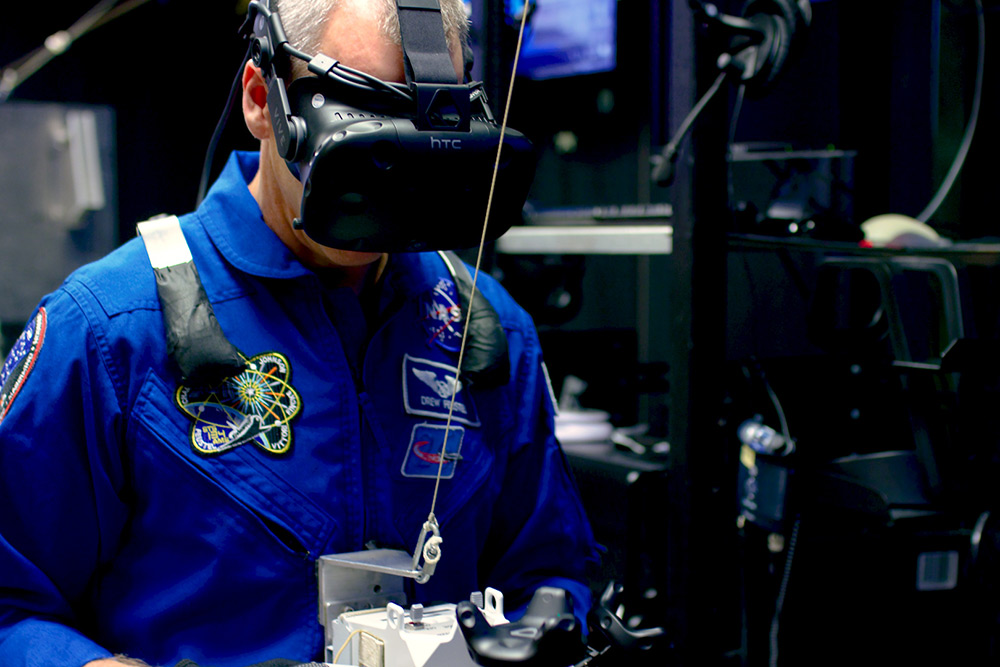 Alumnus astronaut safely arrives at International Space Station | Queen ...